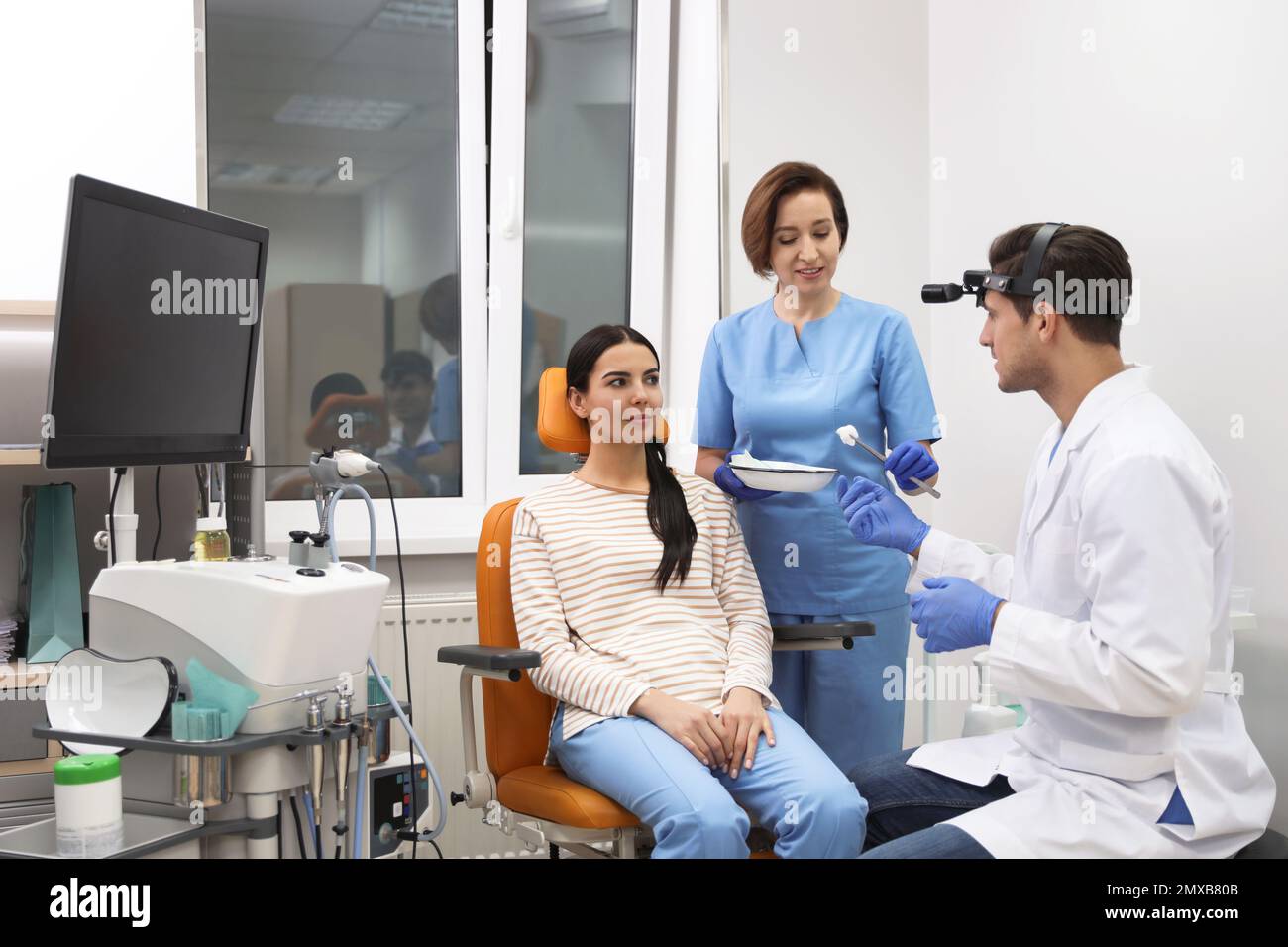 Professional doctors examining patient before surgery in clinic Stock ...