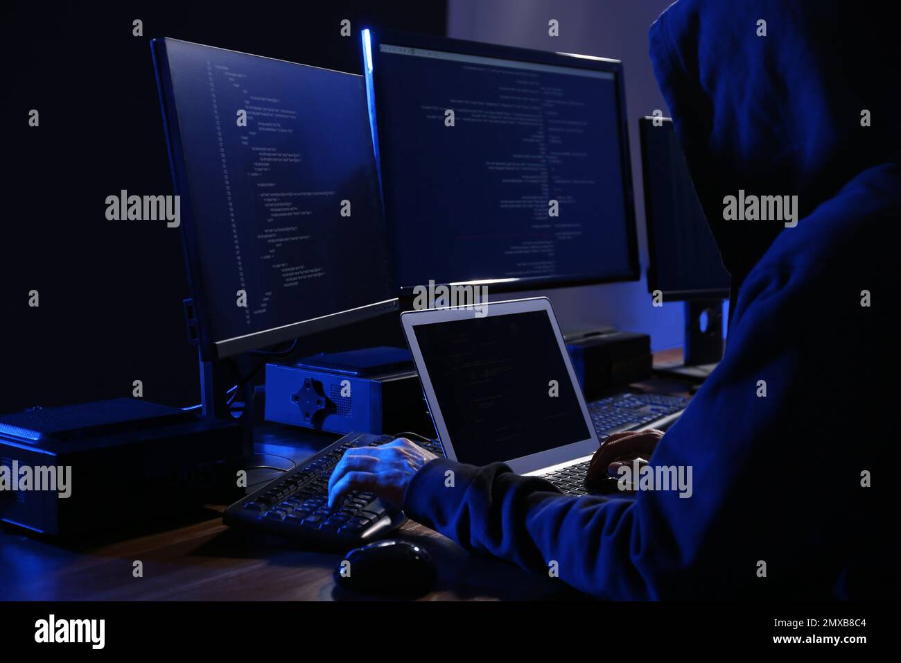 Hacker with computers in dark room. Cyber crime Stock Photo - Alamy