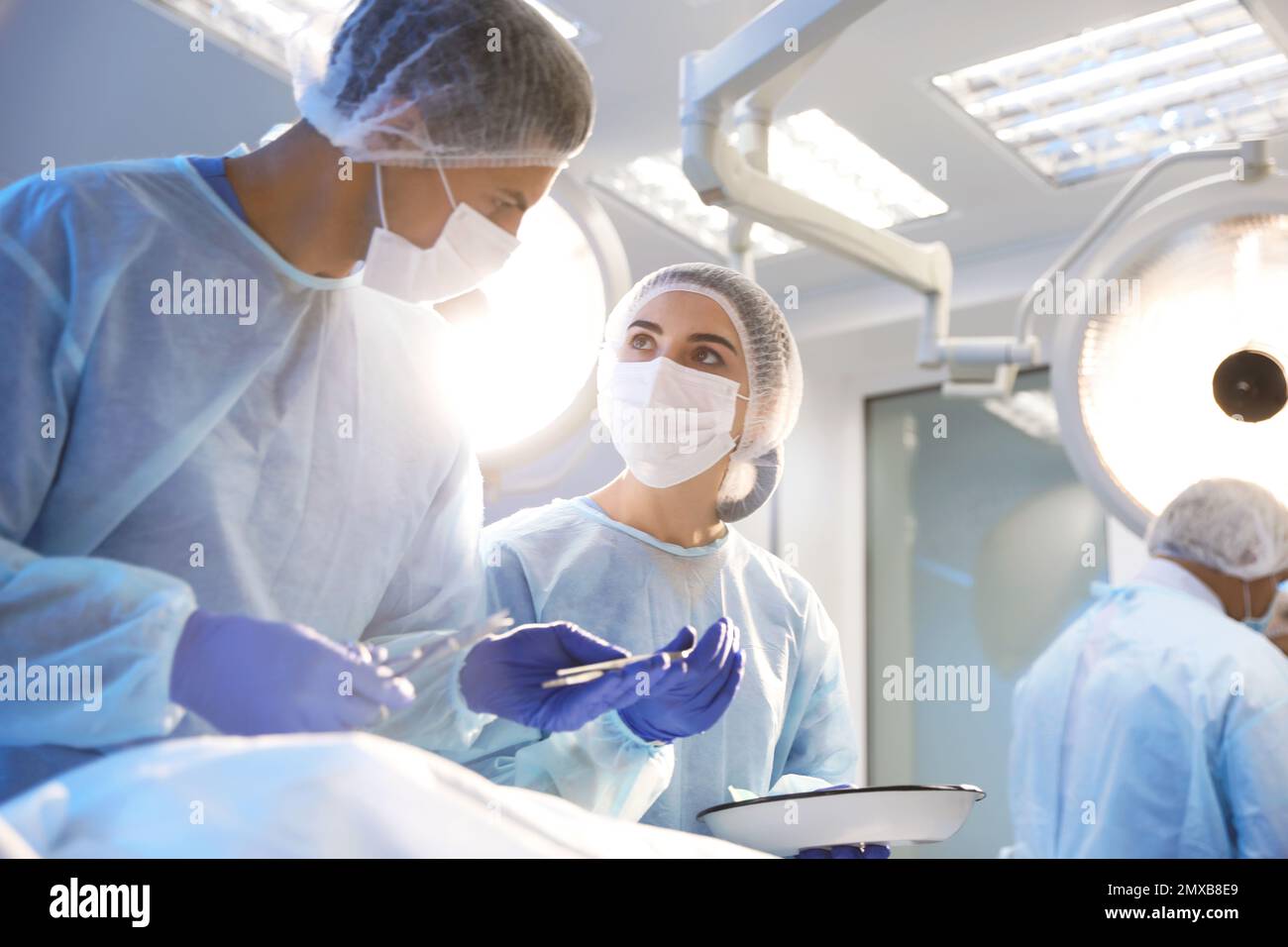 Team of professional surgeons performing operation in clinic Stock ...