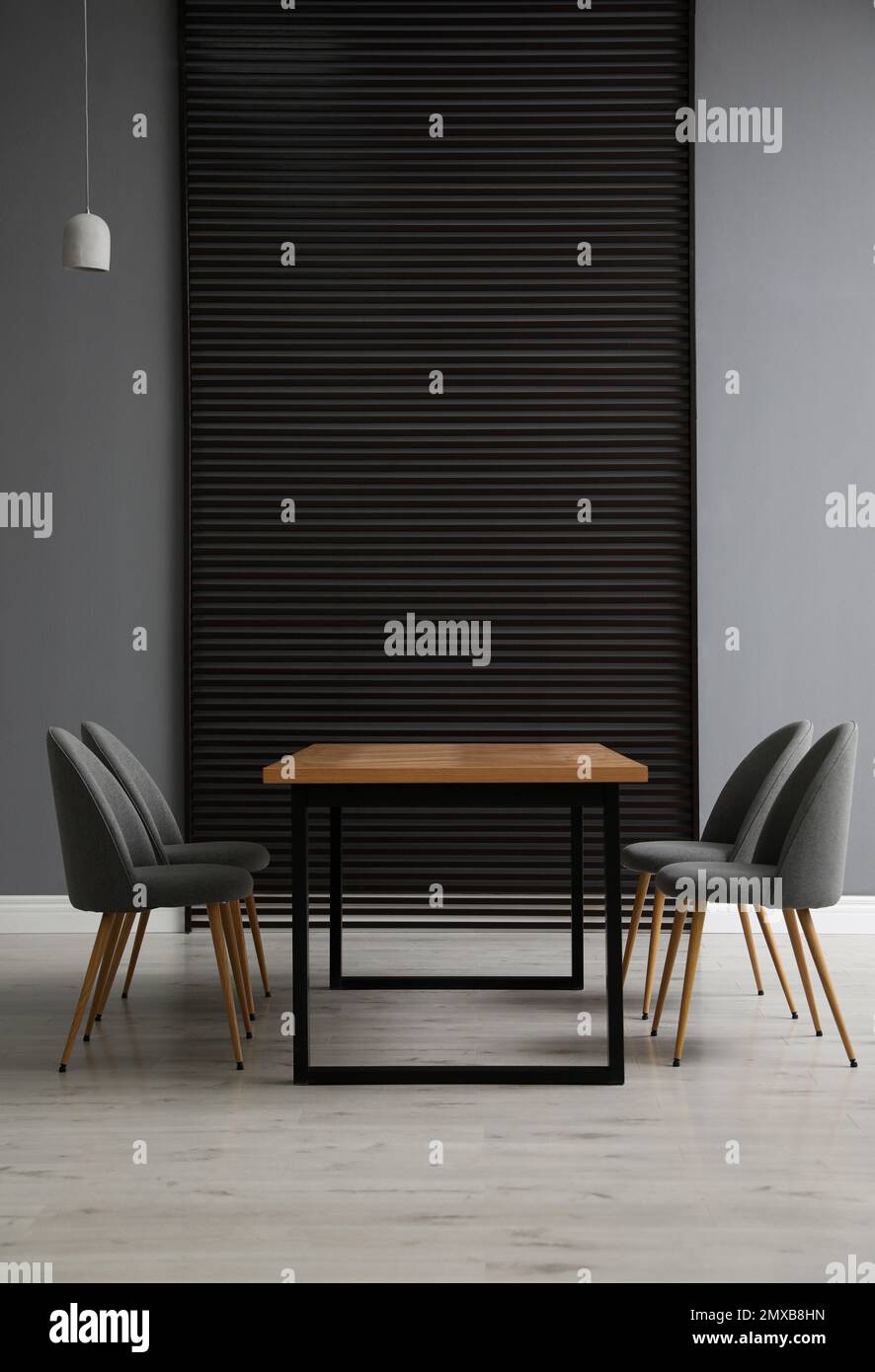 Table and chairs in room. Stylish interior design Stock Photo - Alamy
