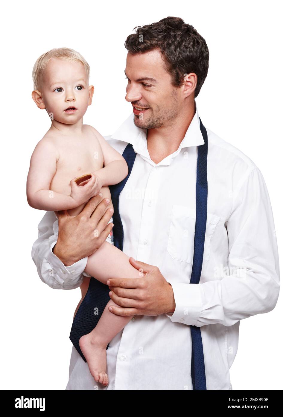 Hello my boy. A businessman holding his son after a long day at work ...