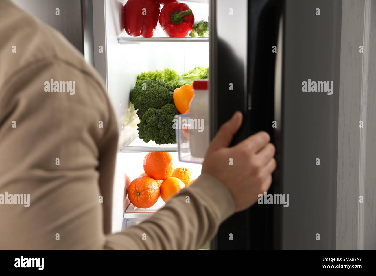 Hand opening refrigerator hi-res stock photography and images - Alamy