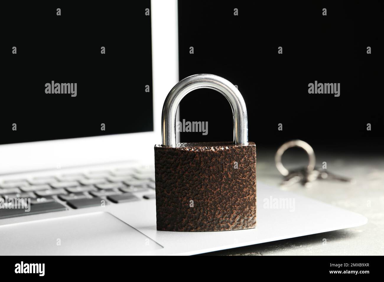 Laptop locked to desk hi-res stock photography and images - Alamy