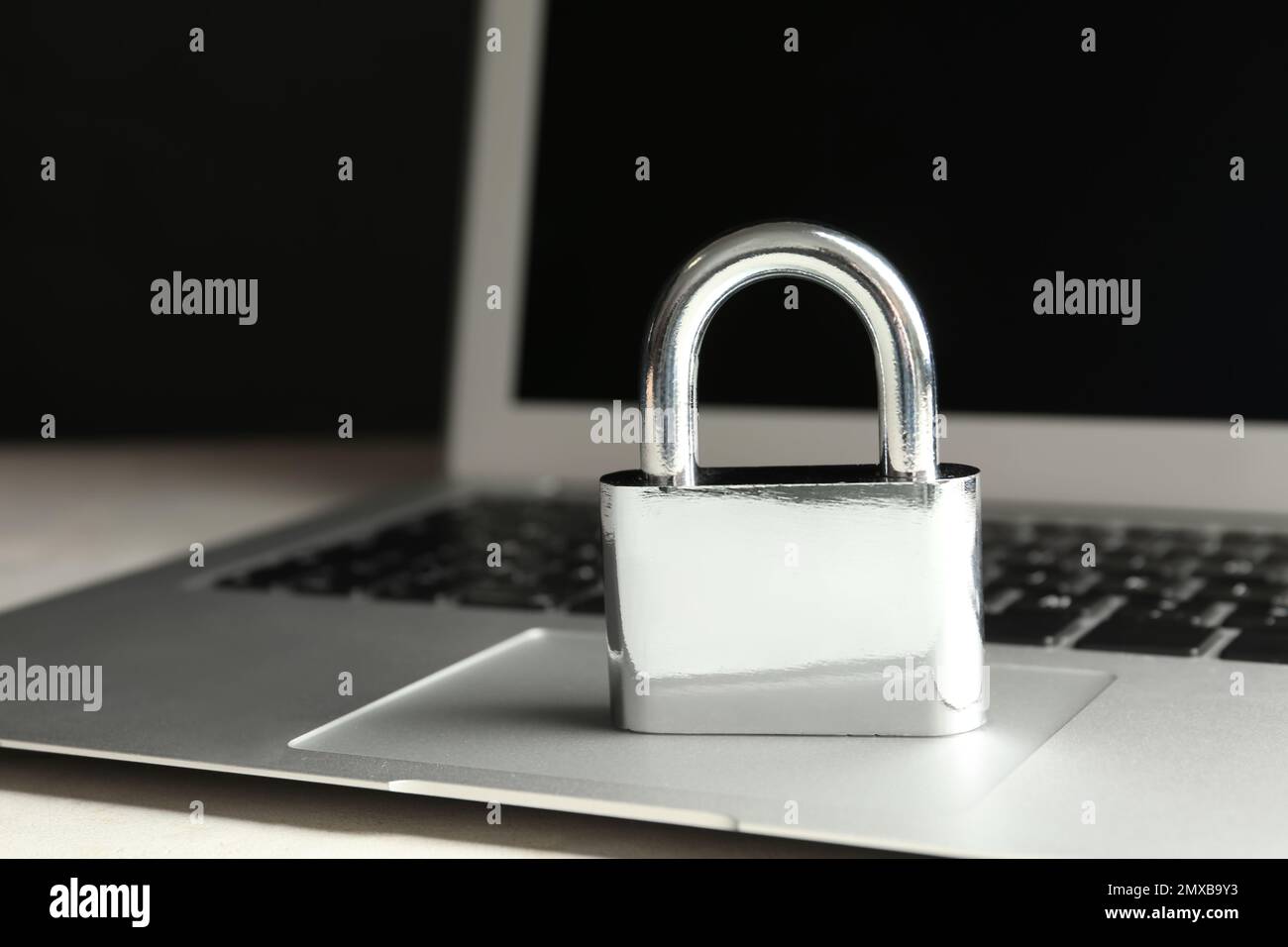 Laptop locked to desk hi-res stock photography and images - Alamy