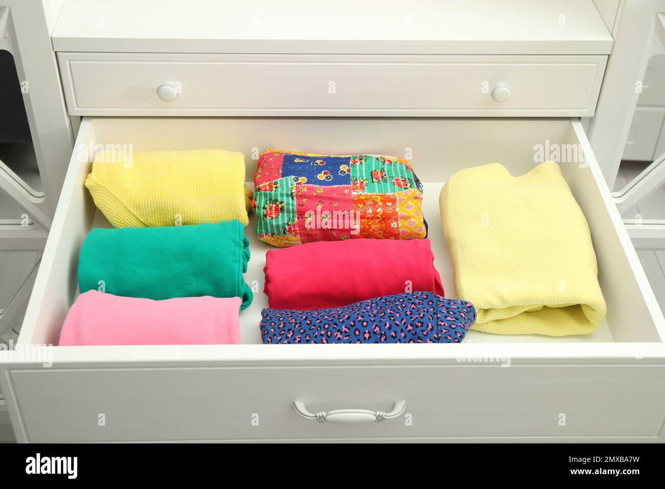 Open wardrobe folded clothes hi-res stock photography and images - Alamy