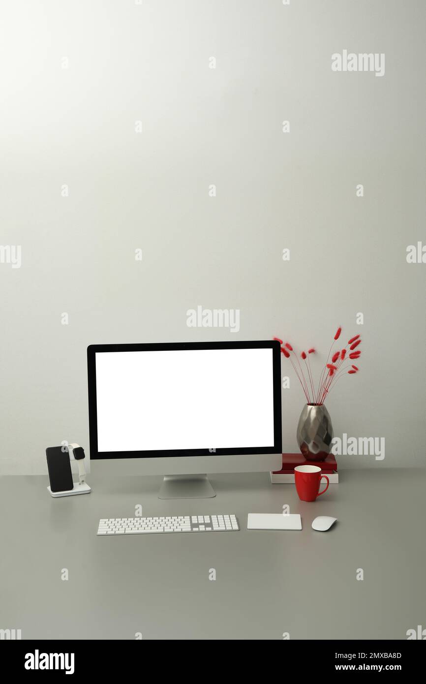 Modern workplace with computer and charging devices. Interior design ...