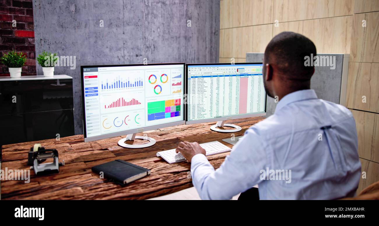 Computer Spreadsheet Data Analyst Man Using Multiple Screens Stock ...