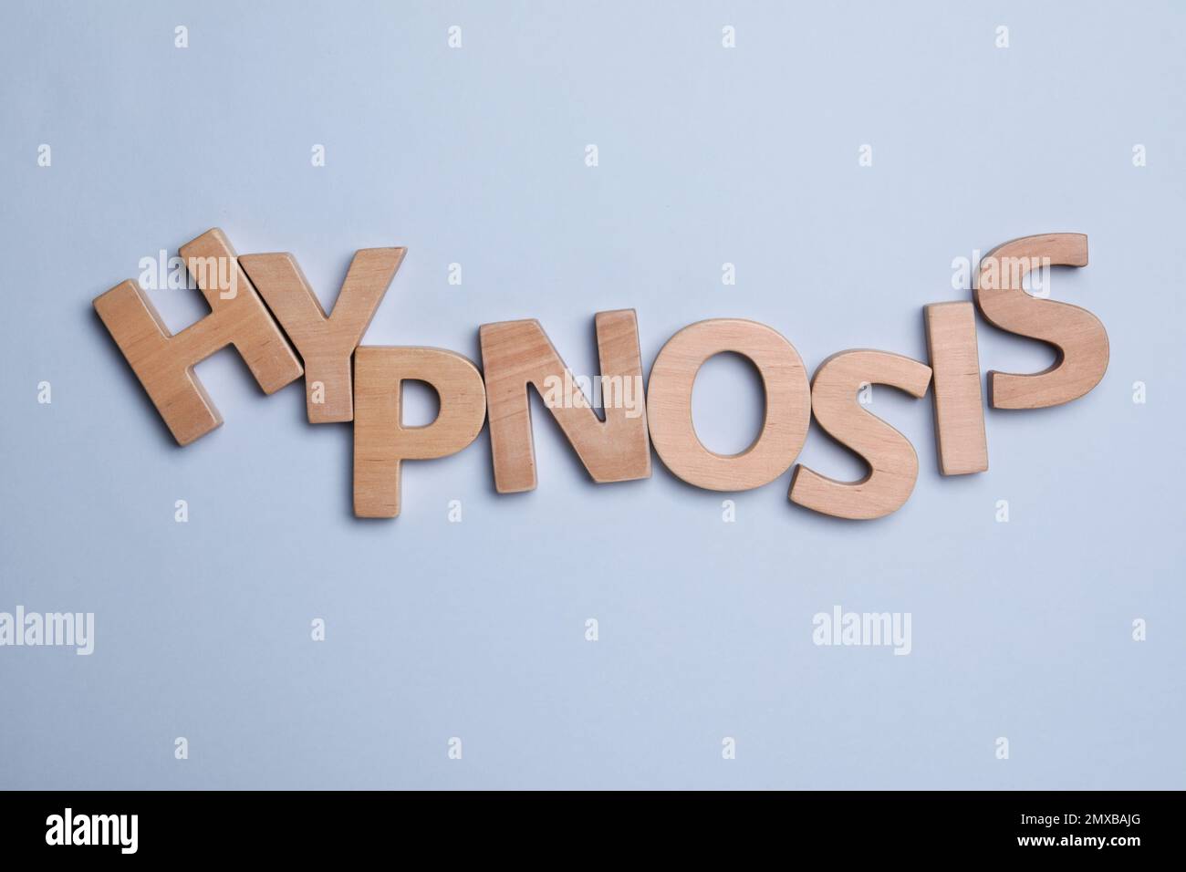Word HYPNOSIS made with wooden letters on light background, flat lay ...