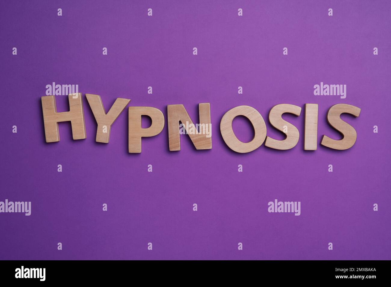 Word HYPNOSIS made with wooden letters on purple background, flat lay ...