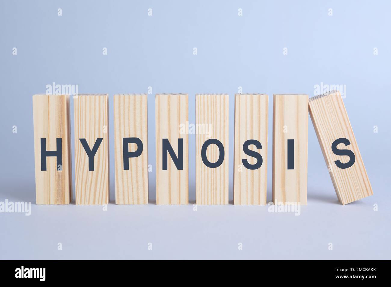 Wooden blocks with word HYPNOSIS on white background Stock Photo - Alamy