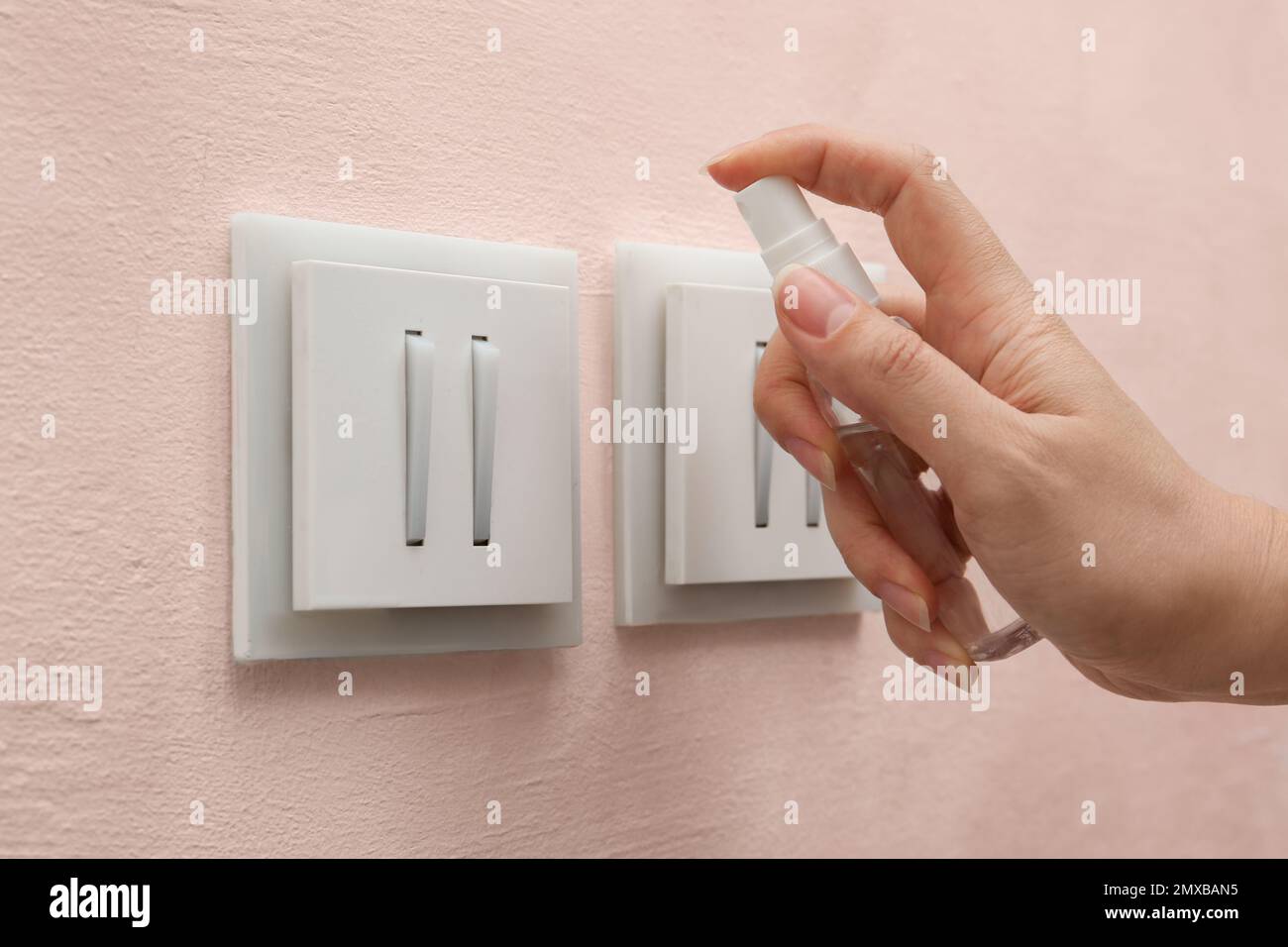 Woman cleaning light switch hi-res stock photography and images - Alamy