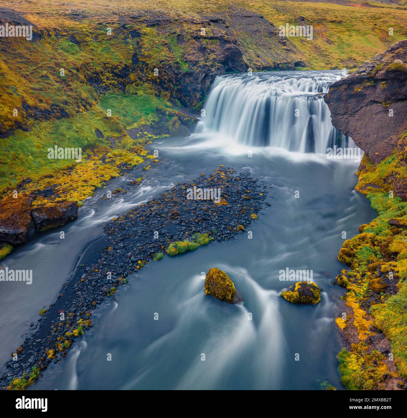 Fantastic summer scenery. Picturesque morning scene of waterfall on ...