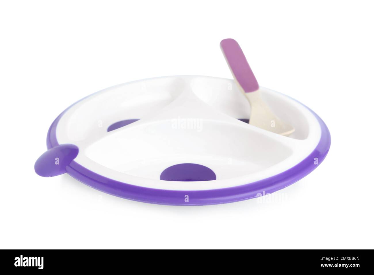 Plastic section plate with spoon isolated on white. Serving baby food ...