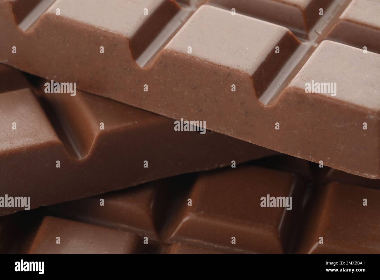 Delicious milk chocolate as background, closeup view Stock Photo - Alamy