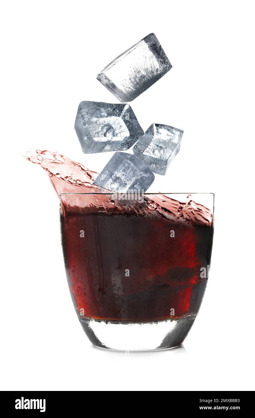 Crystal ice cubes falling into refreshing drink on white background ...