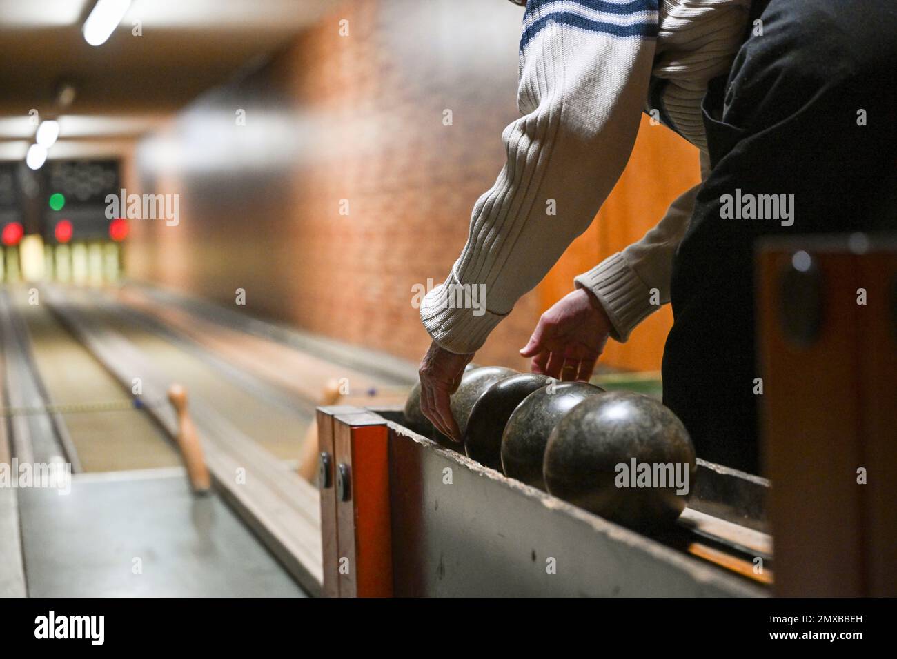 Berlin, Germany. 01st Feb, 2023. A woman takes a ball from the ball ...