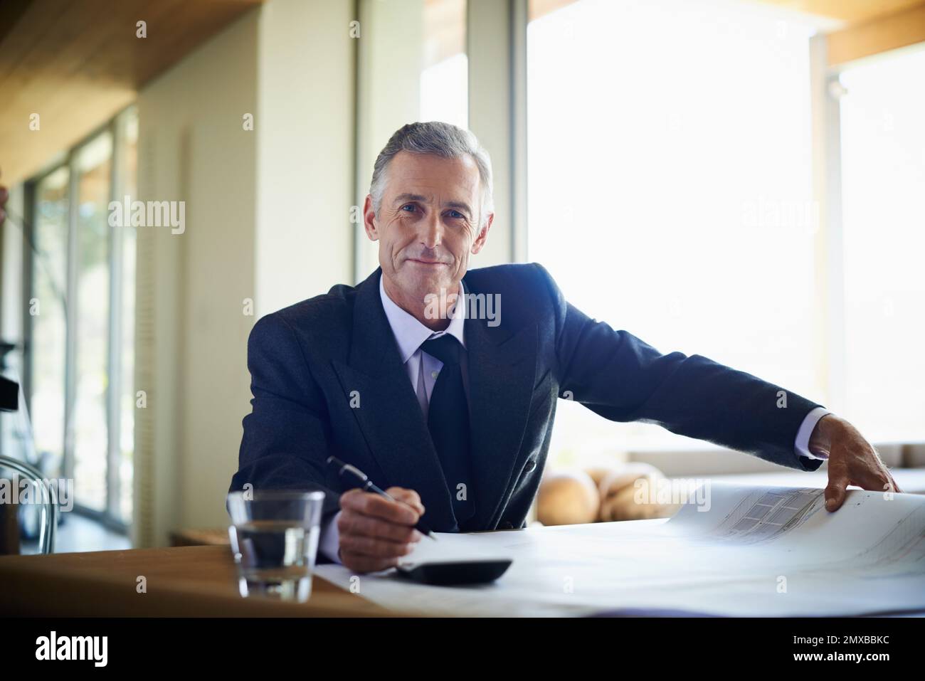 Hes a professional planner. A professional businessman going over some ...