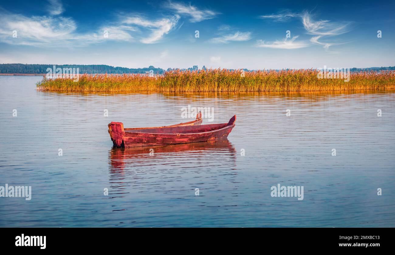 Two wooden fishing boats on the Svityaz lake. Calm morning scene of ...