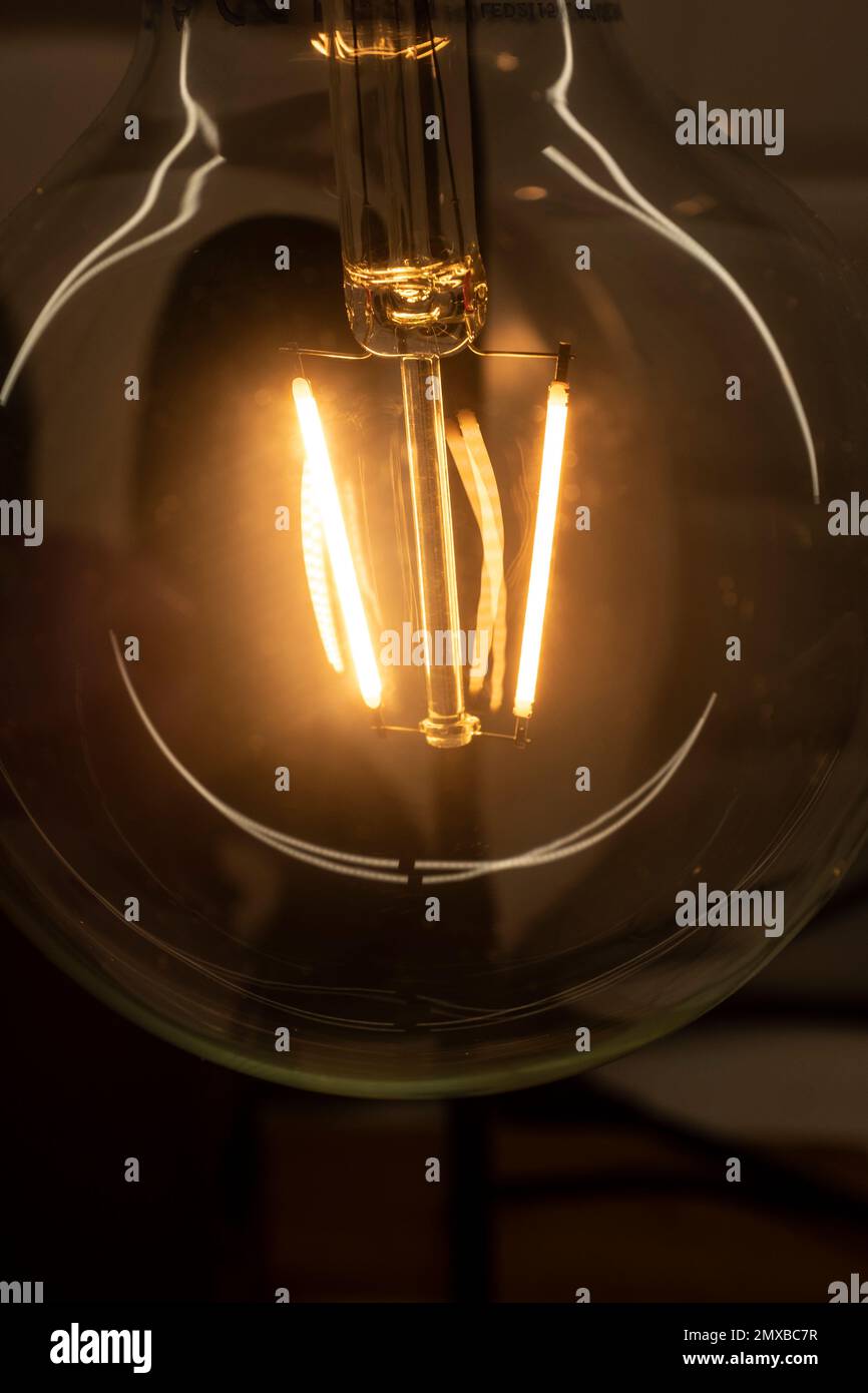 Shining light bulb lighting inside a glass bulb Stock Photo - Alamy