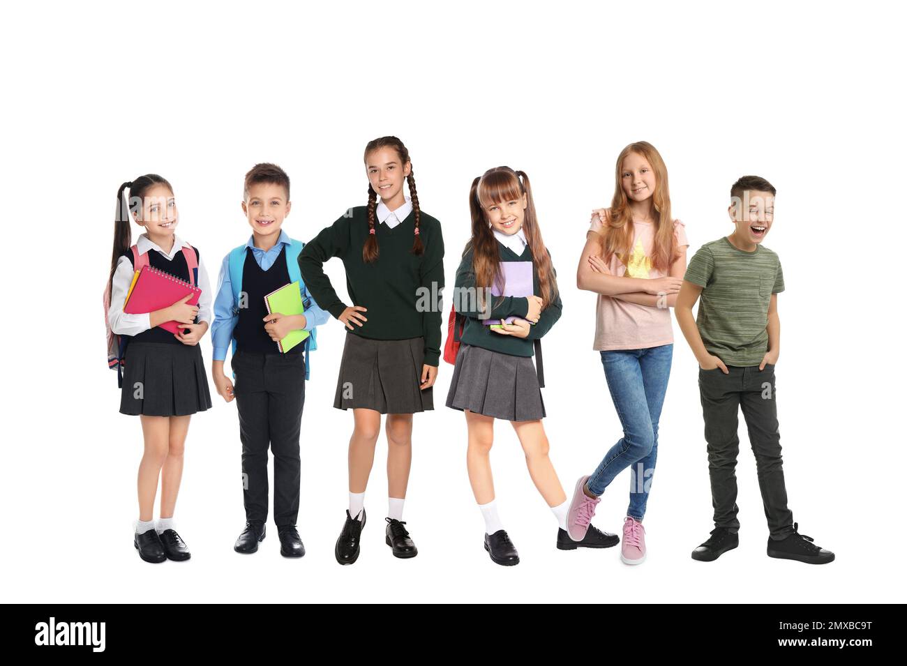 Group of cute school children on white background Stock Photo - Alamy