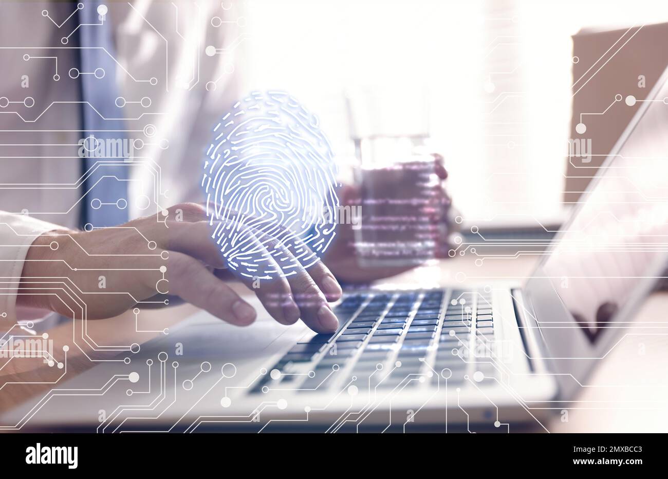 Fingerprint identification. Man working with laptop at table, closeup ...