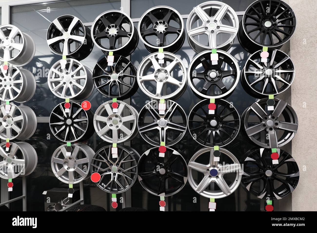 Alloy wheels on display in auto store Stock Photo - Alamy