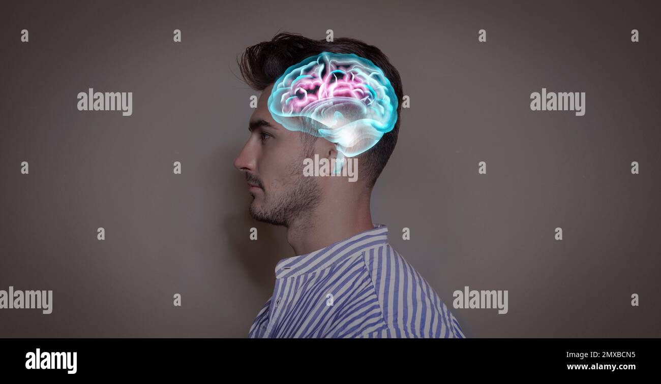Thinking concept. Young man and illustrated brain on color background ...