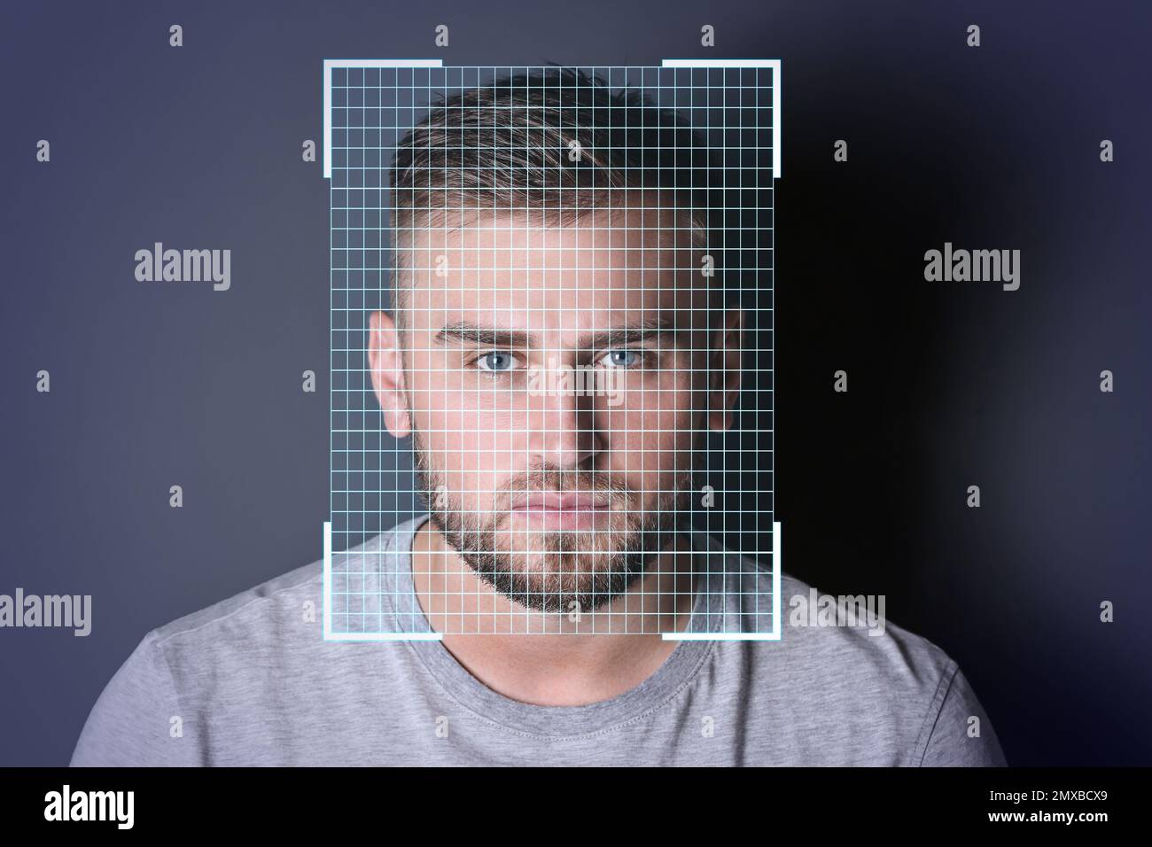 Facial recognition system. Young man with scanner frame and digital ...