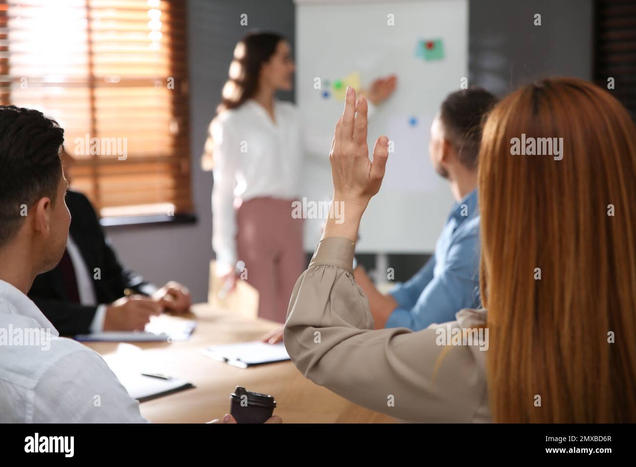 Woman raising hand question hi-res stock photography and images - Alamy
