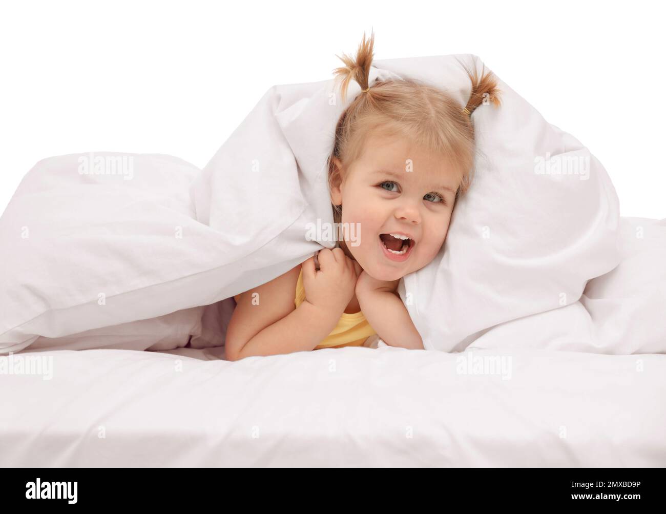Cute little child playing under blanket in bed Stock Photo - Alamy