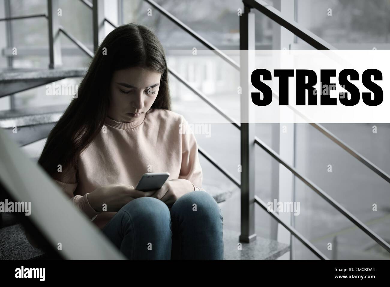 Depressed young girl sitting on stairs indoors and word STRESS Stock ...