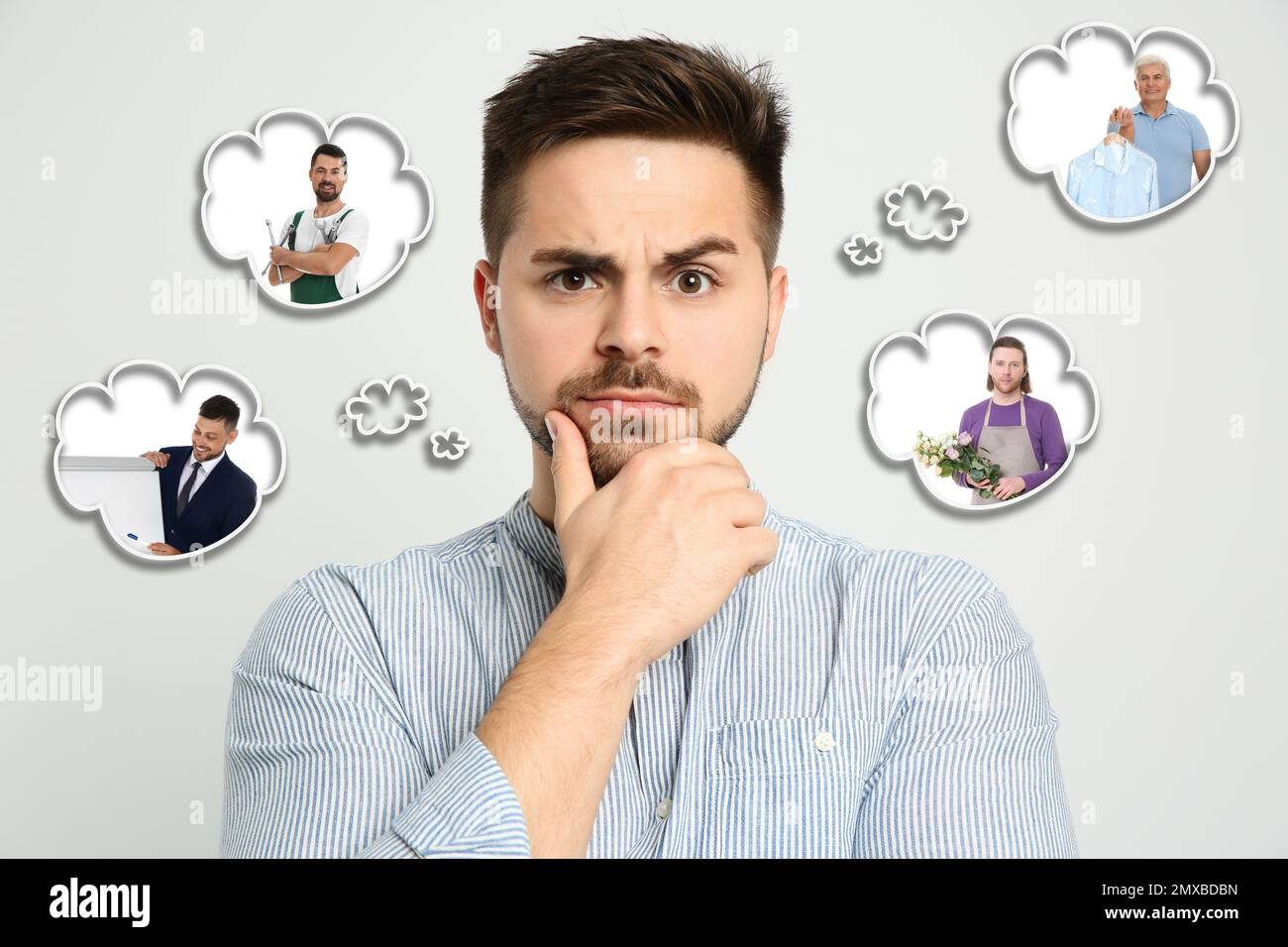 Puzzled man thinking about probable profession on light bakground Stock ...