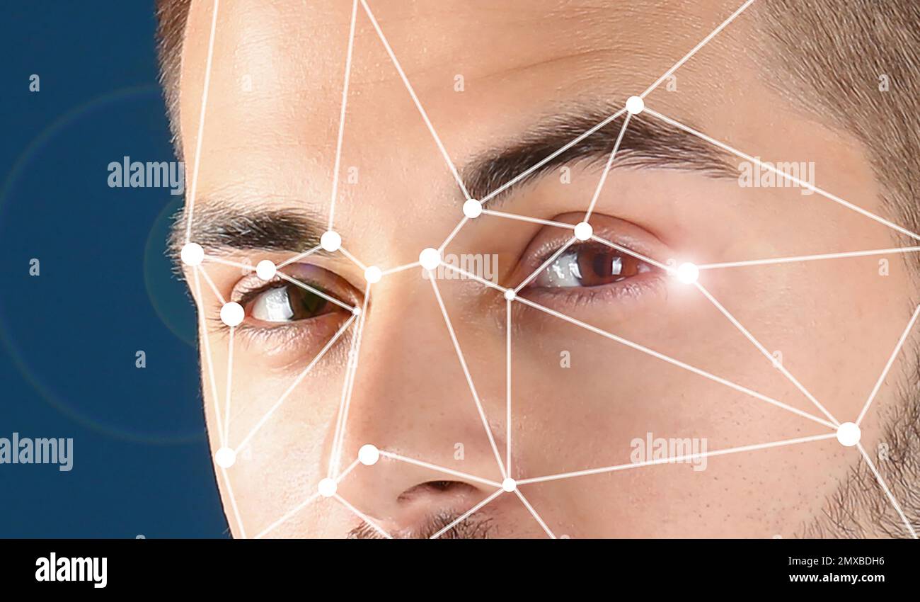 Facial recognition system. Young man with digital biometric grid ...