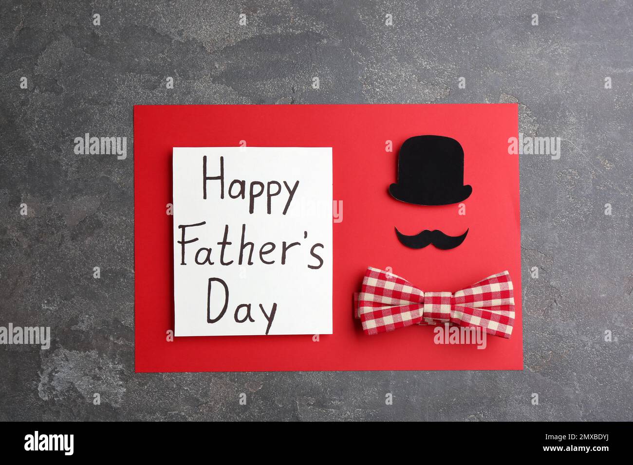 Greeting card with words HAPPY FATHER'S DAY on grey stone background ...