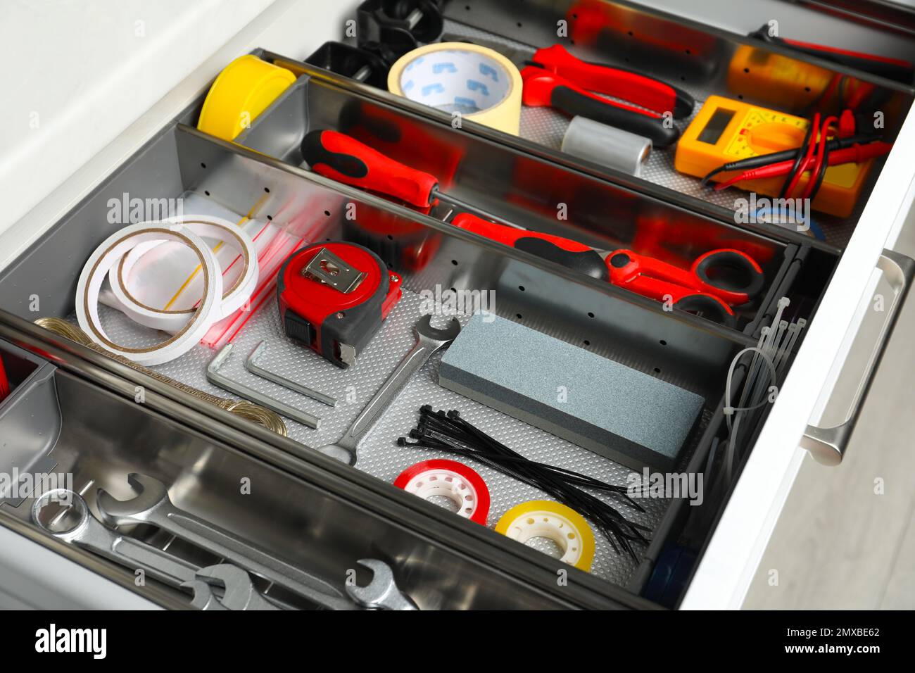 Set of instruments in open desk drawer indoors, closeup Stock Photo - Alamy