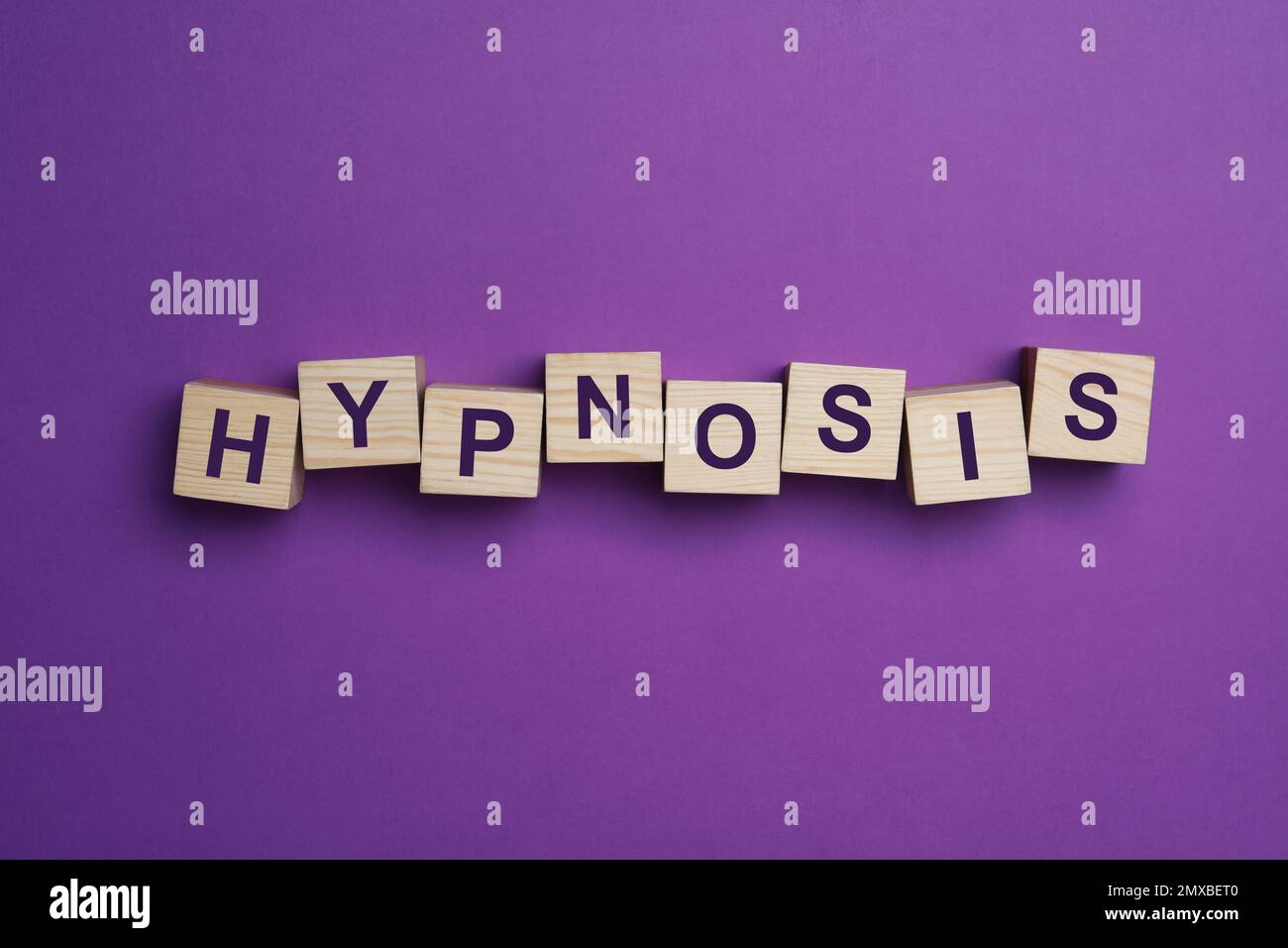 Wooden blocks with word HYPNOSIS on purple background, flat lay Stock ...