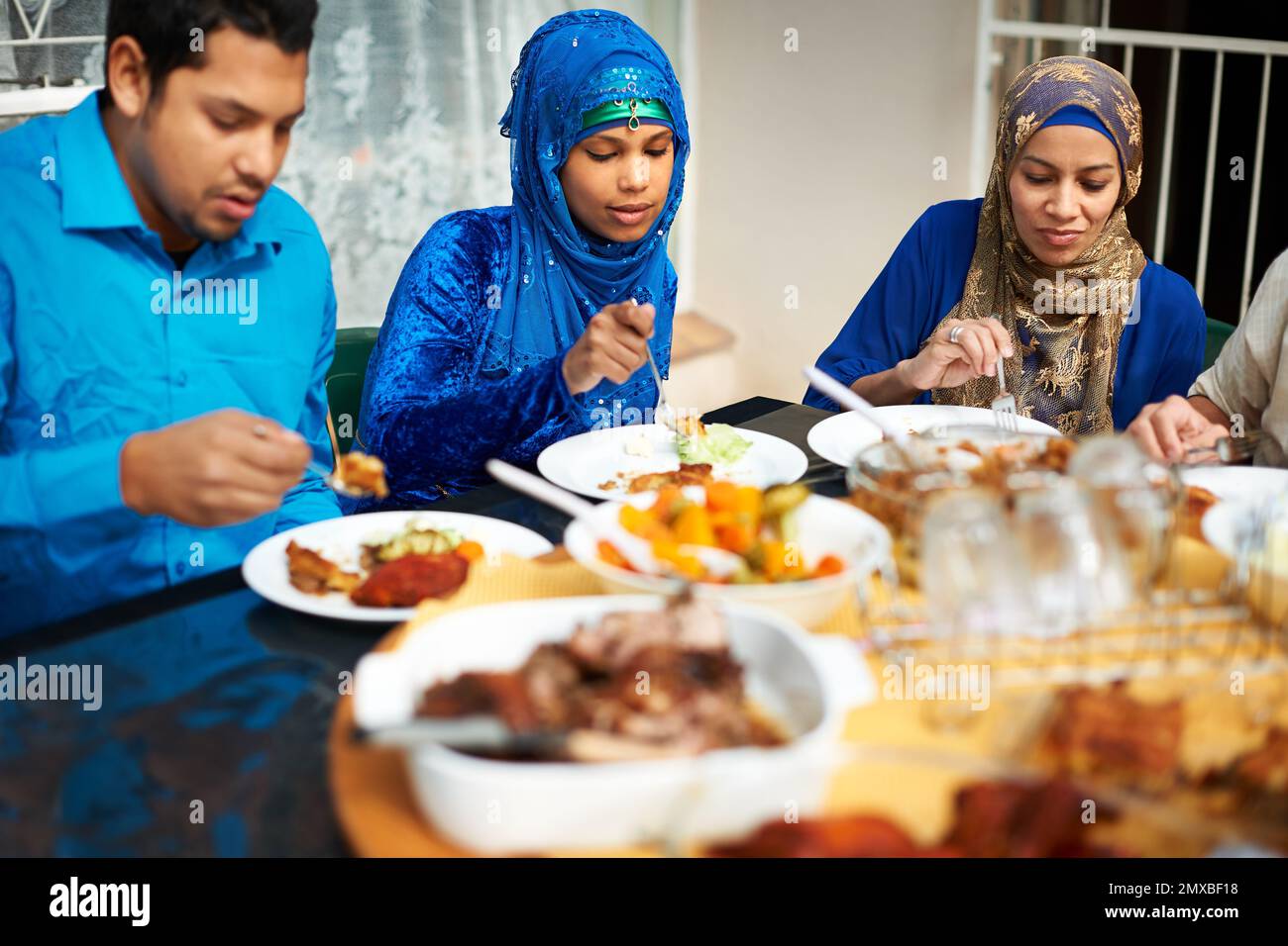 Food tastes better when you share it with family. a muslim family ...