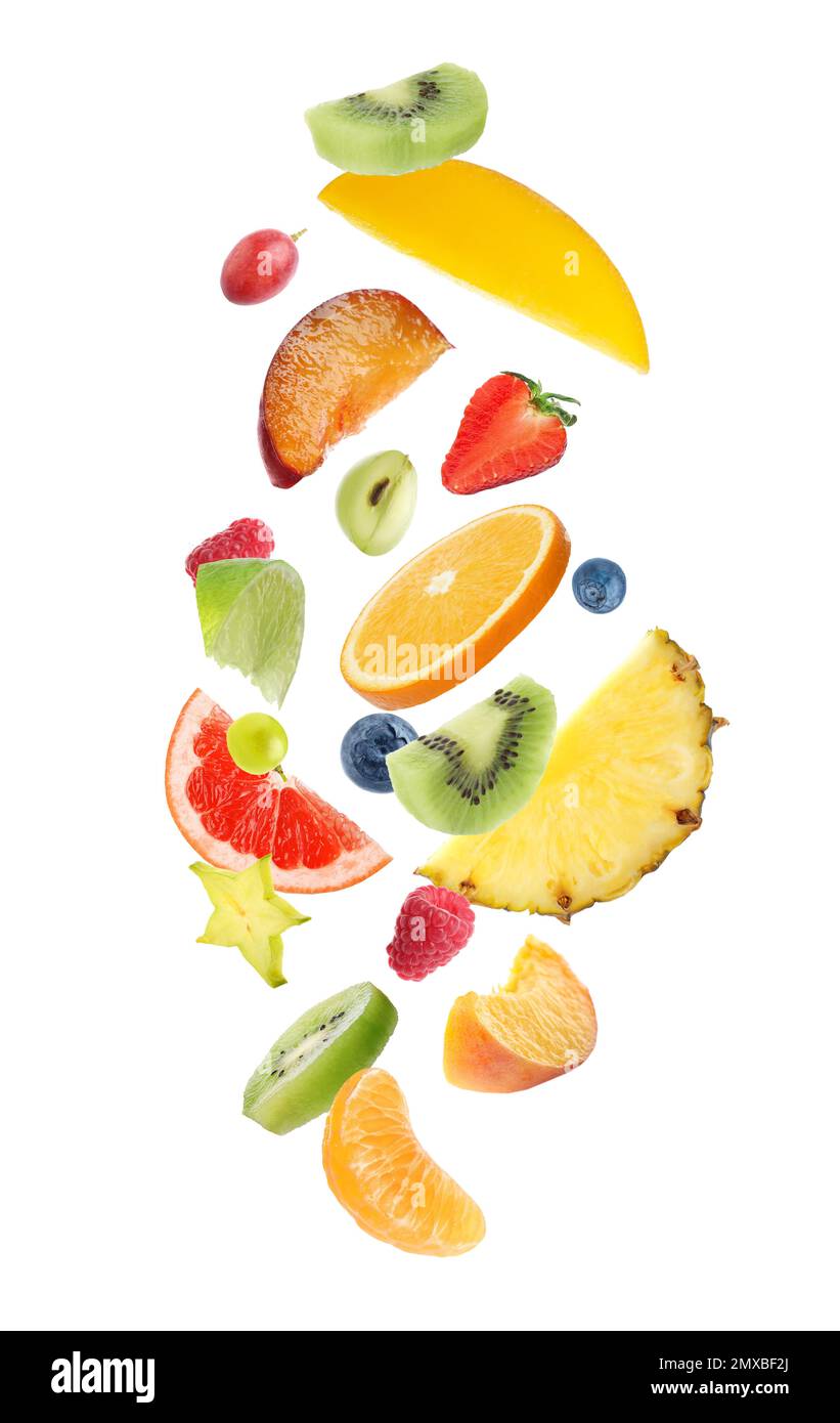 Fresh tasty fruits and berries falling on white background Stock Photo ...