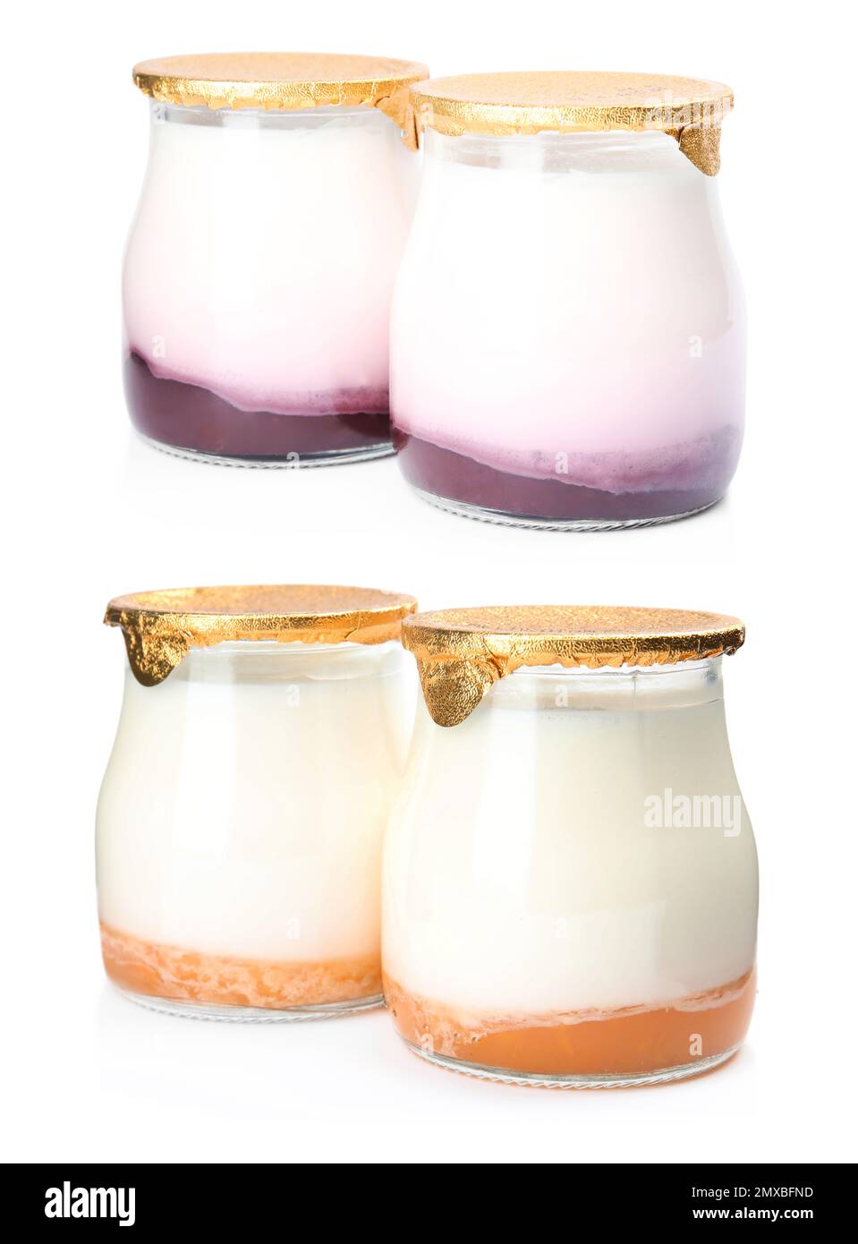 Set of delicious natural yogurts in jars on white background Stock ...