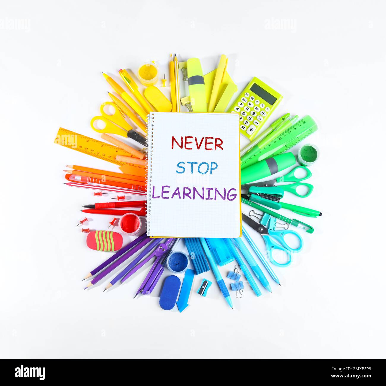 Notebook with phrase NEVER STOP LEARNING and different school ...