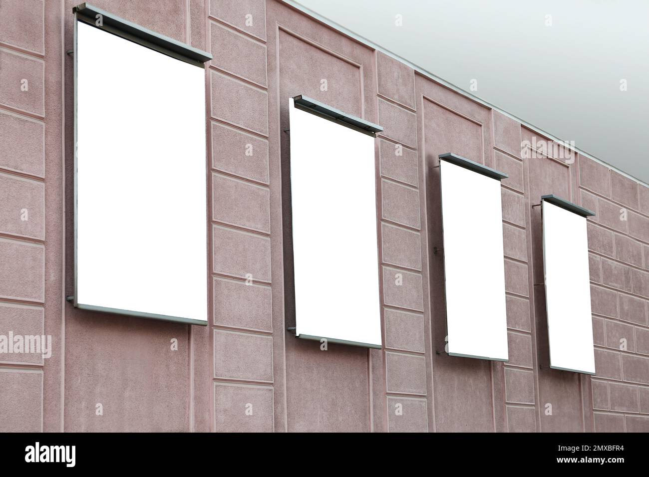 Blank banners on building facade outdoors. Advertising board design ...