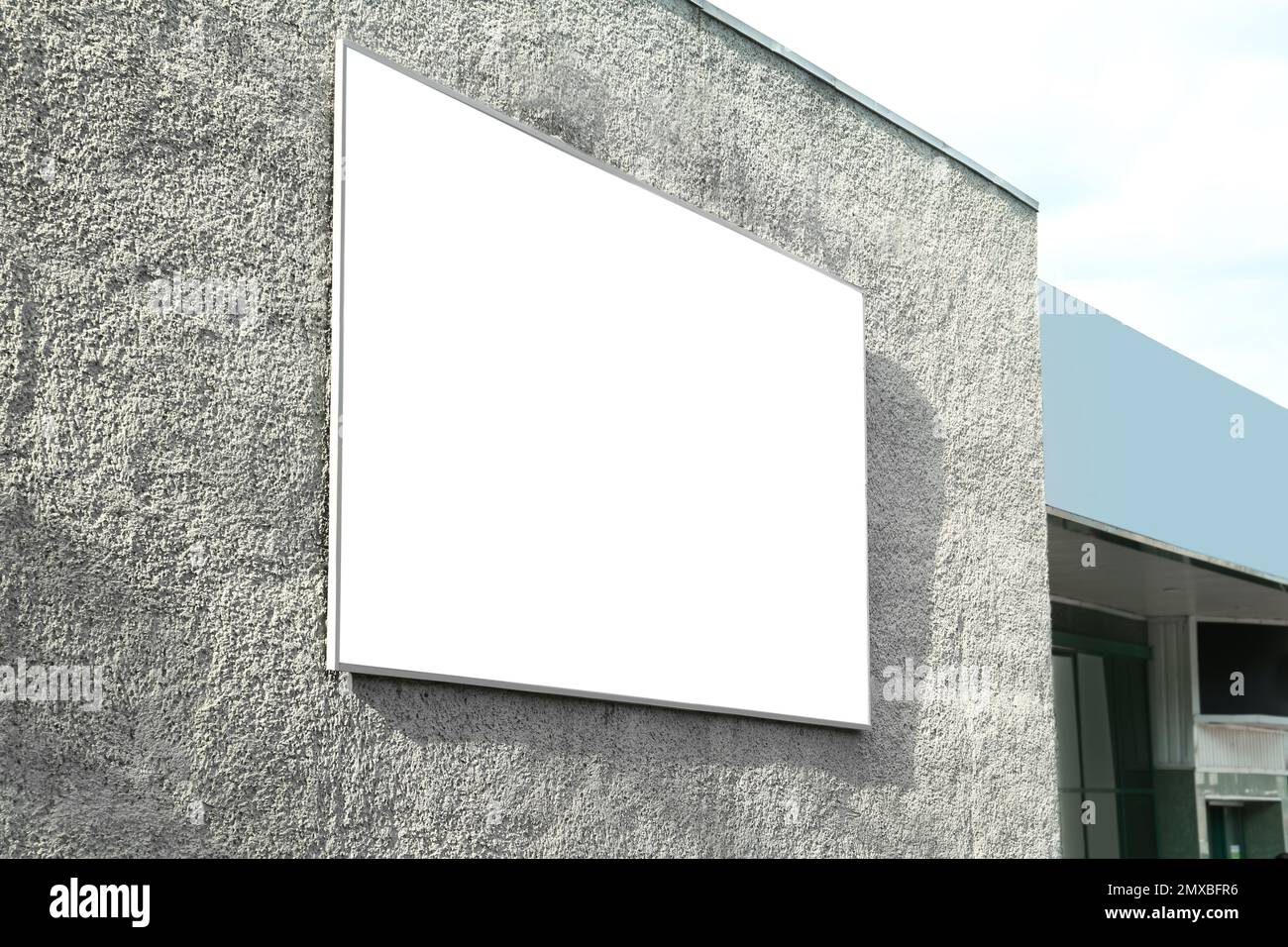 Blank banner on building facade outdoors. Advertising board design ...