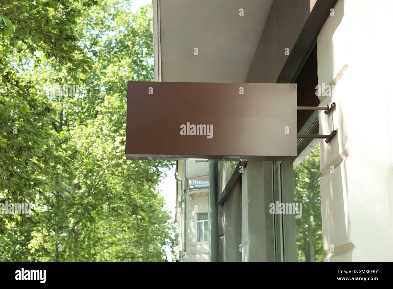 Blank lightbox signage on building wall outdoors. Advertising board ...