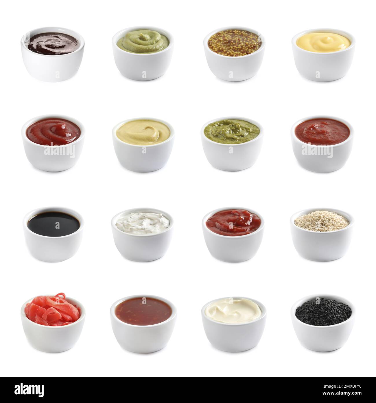 Set of different delicious sauces and condiments on white background ...