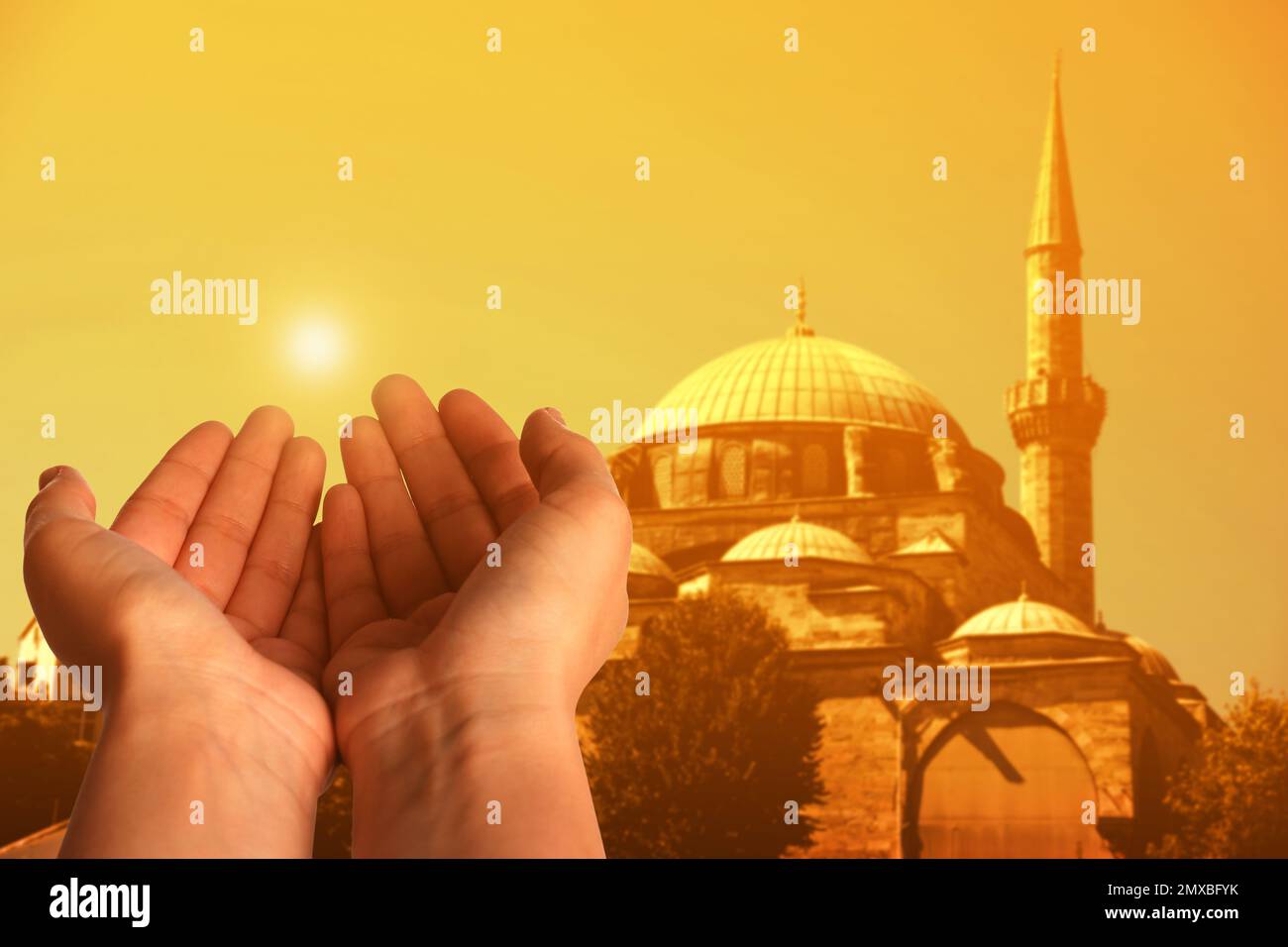 Muslim woman praying near mosque at sunset, closeup Stock Photo - Alamy
