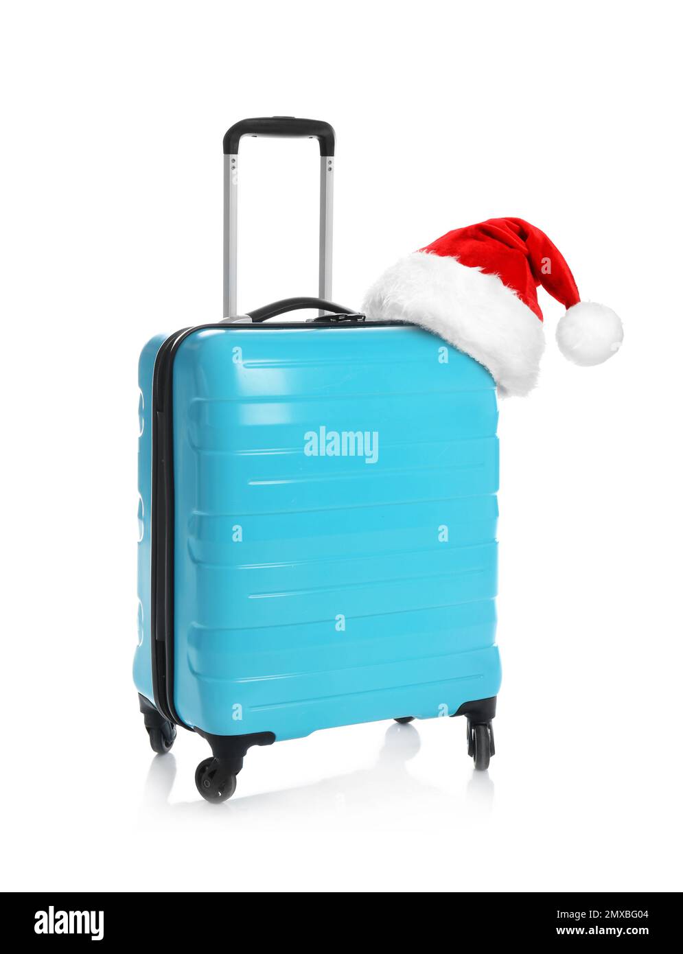 Stylish suitcase with Santa Claus hat isolated on white. Christmas ...