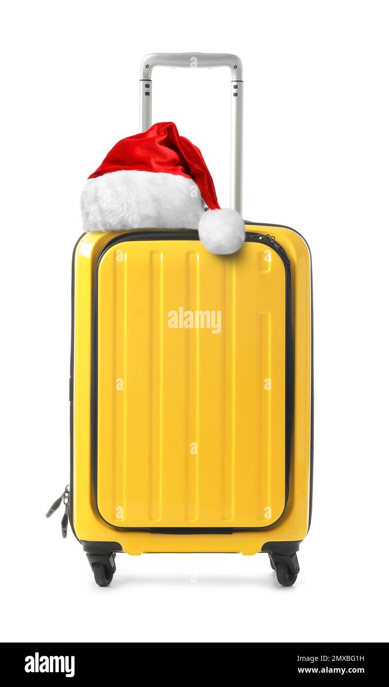 Stylish suitcase with Santa Claus hat isolated on white. Christmas ...