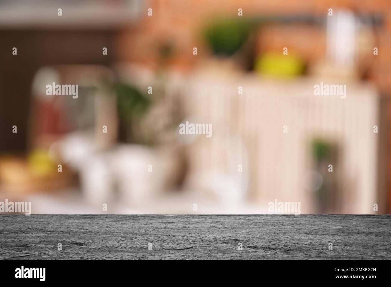 Empty black stone table in modern kitchen interior Stock Photo - Alamy