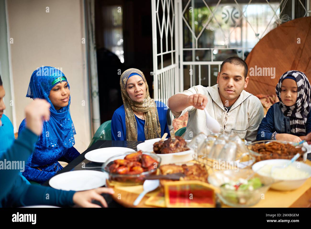 Malay family eating hi-res stock photography and images - Alamy