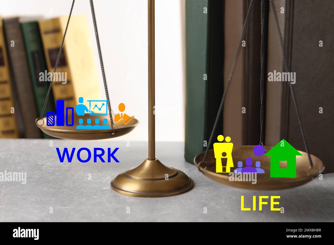 Work-life balance concept. Scale with images on table, closeup Stock ...